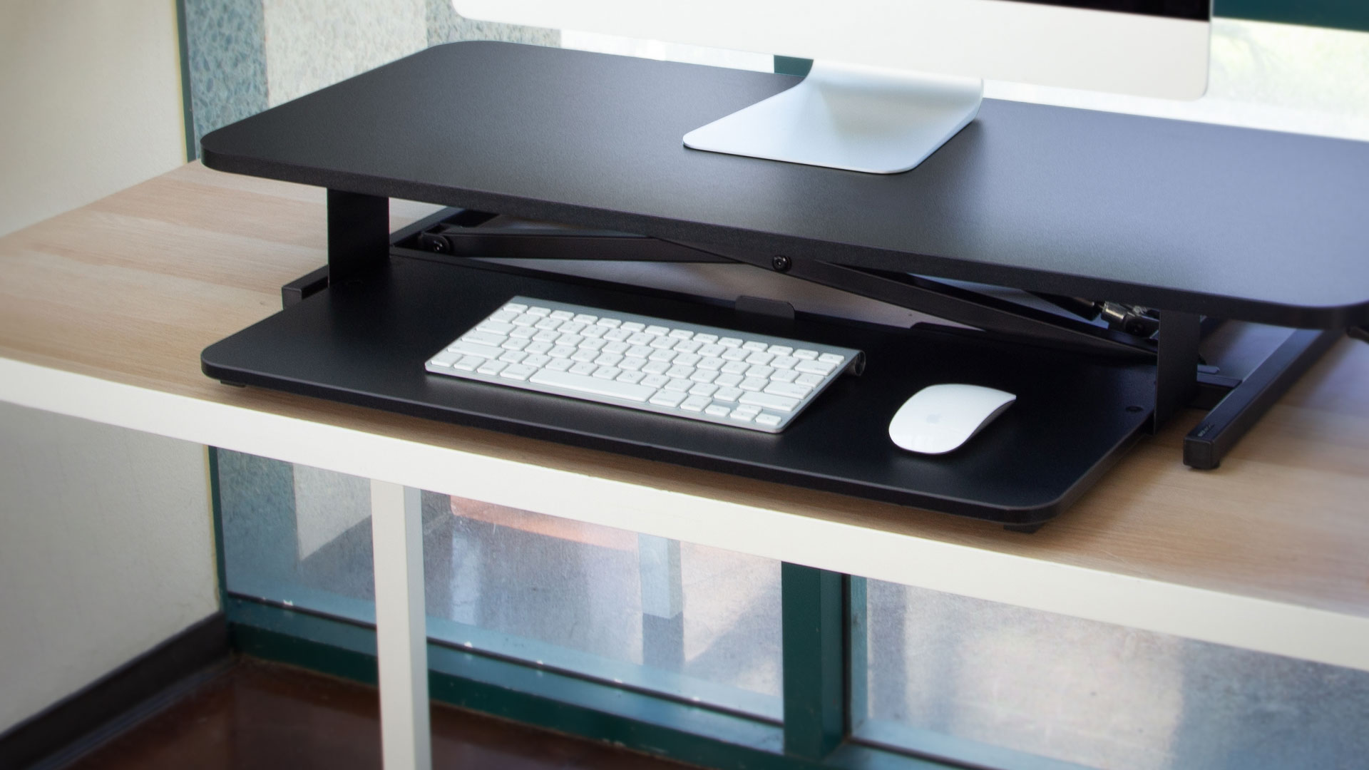 Mount-It Standing Desk Converter makes any desk more ergonomic.